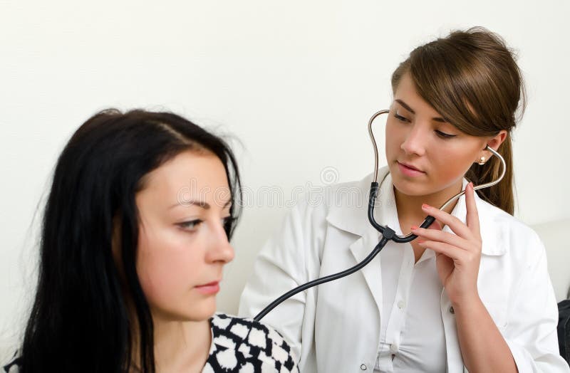 Doctor examines patient stock photo. Image of person - 26693026