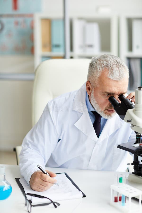 Doctor examining analysis stock image. Image of research - 160173677