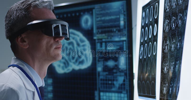 Doctor Examining Brain Scan with VR Headset Stock Photo - Image of ...