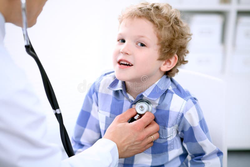 Doctor Examining a Child Patient by Stethoscope Stock Photo - Image of ...