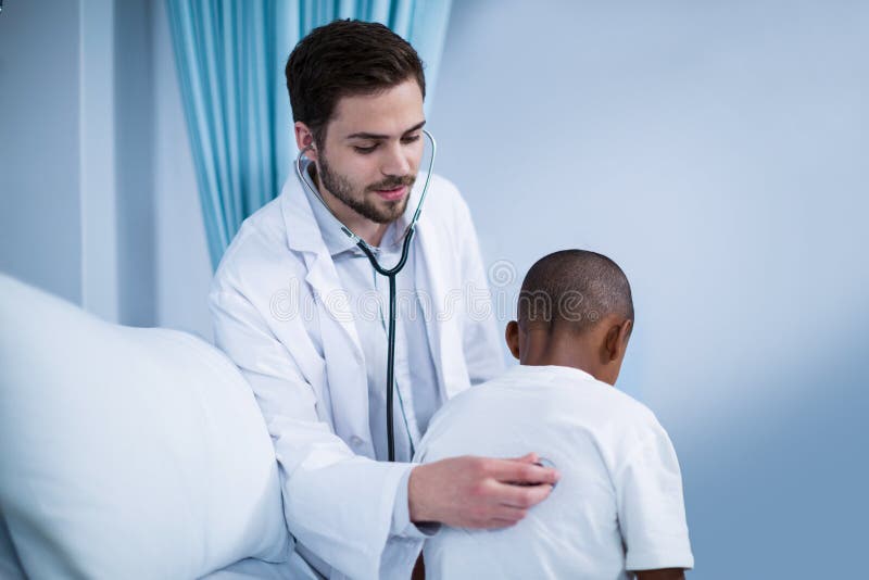 Doctor Examining a Child with Stethoscope Stock Photo - Image of ...