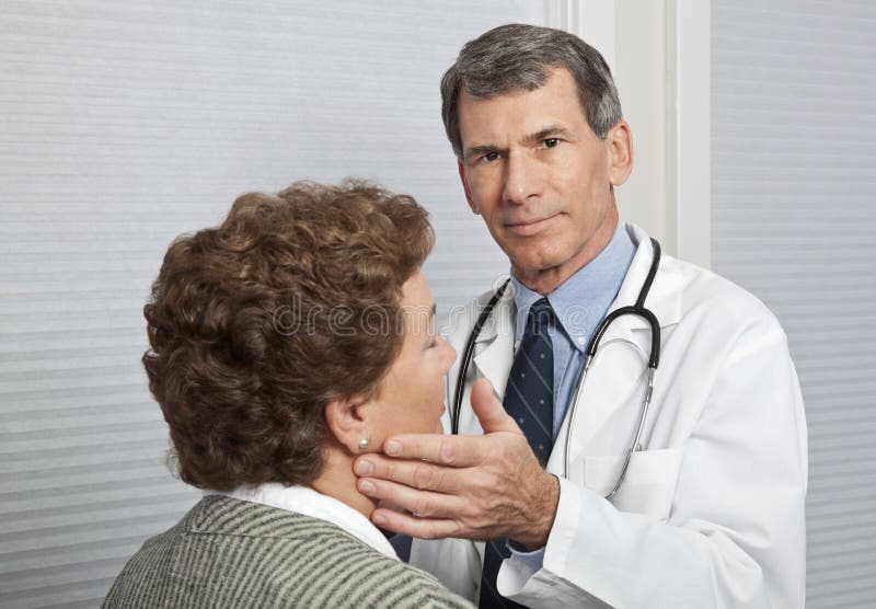 Doctor Examining Female Patient for Flu Symptoms Stock Photo - Image of ...