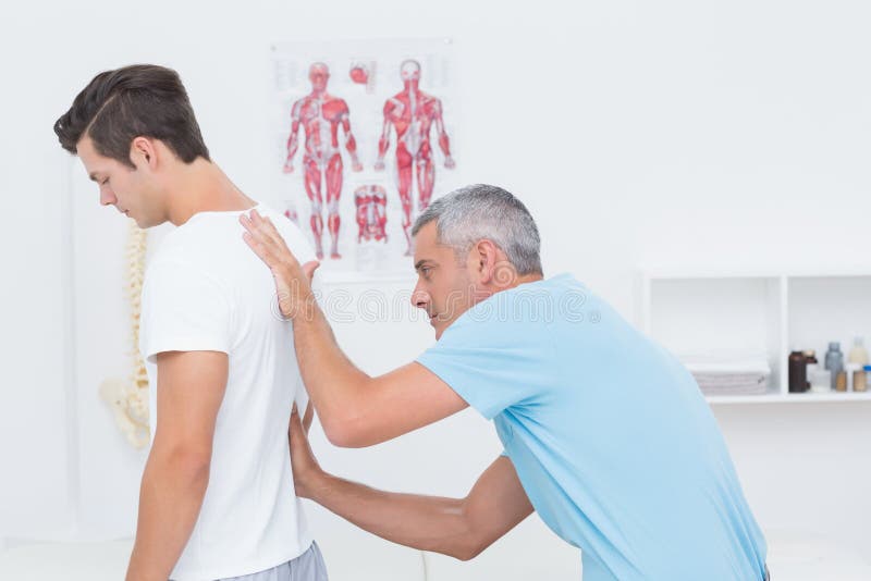 Doctor Examining His Patient Back Stock Image - Image of reeducation ...