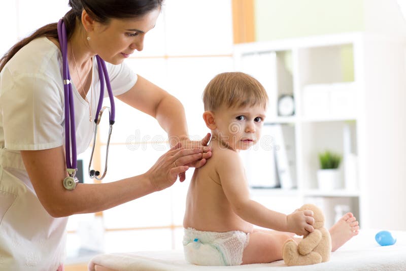 Doctor Examining Kid by Touch in Medical Office Stock Photo - Image of ...