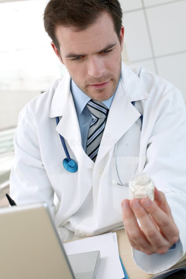 Doctor Examining Medication Side Effects Stock Photo - Image of ...