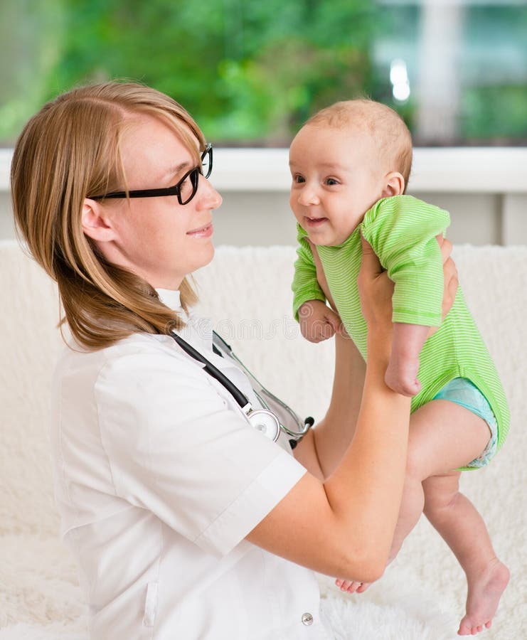 Pediatrician Woman Doctor Holding Baby Stock Photo - Image of bonding ...