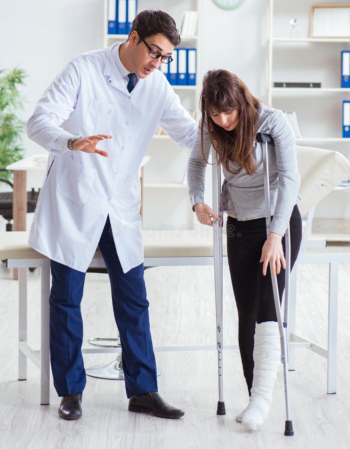 Doctor Examining Patient with Broken Leg Stock Image - Image of ...