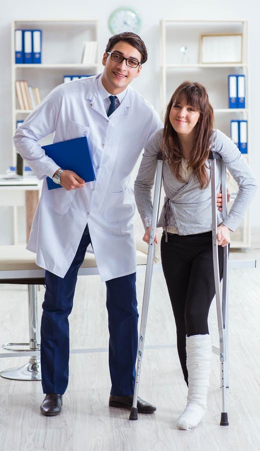 Doctor Examining Patient with Broken Leg Stock Image - Image of ...