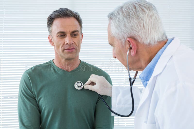 Doctor examining a patient stock image. Image of health - 84085941