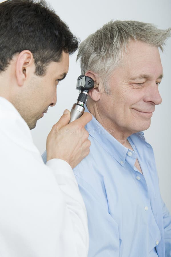Doctor Examining Patient S Ear Using Otoscope Stock Image - Image of ...