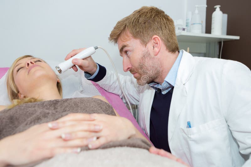 Doctor Examining Patients Ear Stock Photo - Image of otoscopy ...