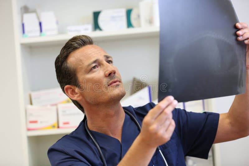 Doctor Examining X-ray Results Stock Image - Image of profession ...