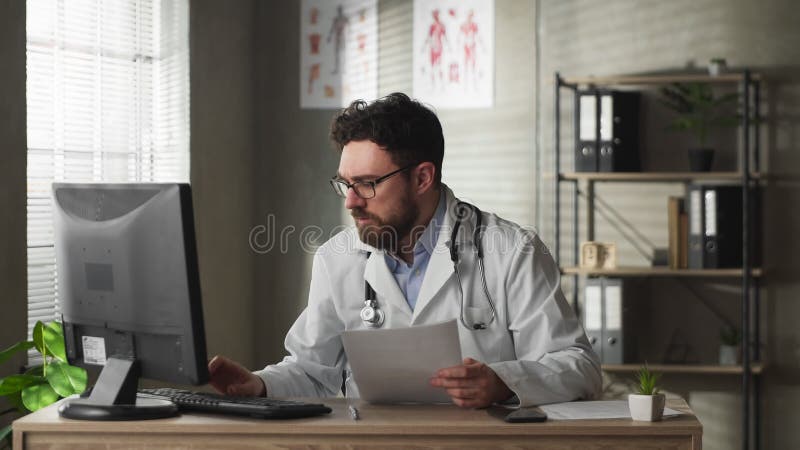 Doctor Experiencing Stress at Work is Propping Head and Touching His ...