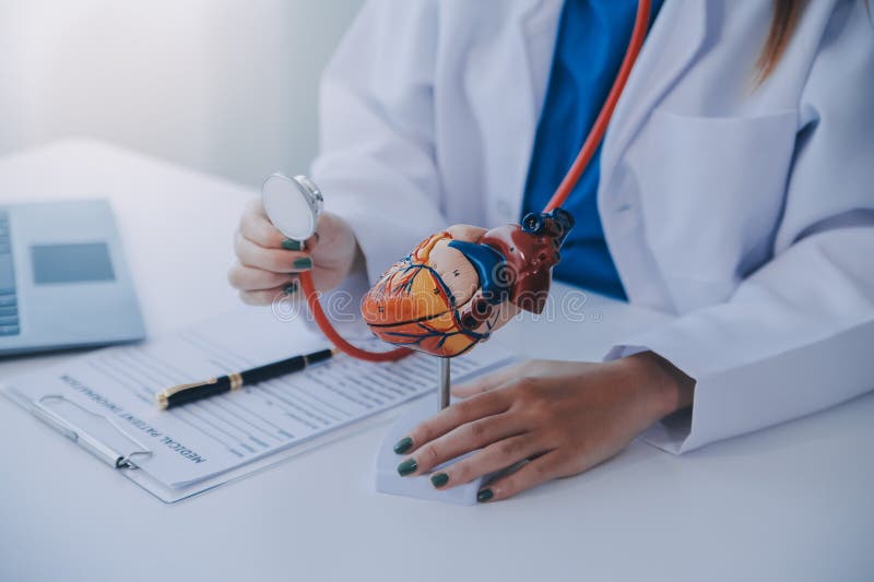 Doctor Explaining Heart To Elderly Patient. Doctor Explaining the Heart ...