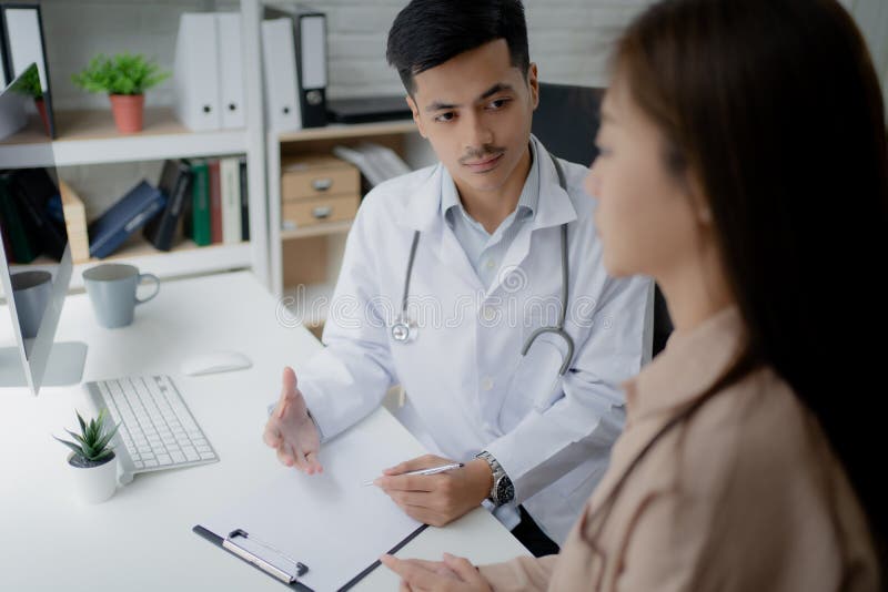 Doctor is Explaining How To Treat Patients in the Office Stock Photo ...