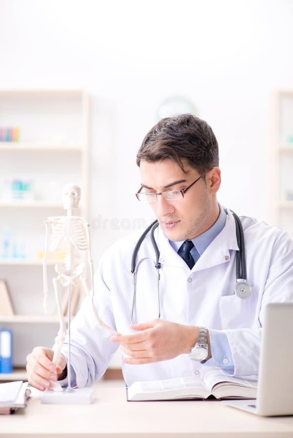 The Doctor Explaining Human Body on Skeleton Stock Image - Image of ...