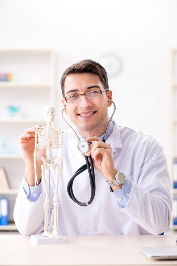 The Doctor Explaining Human Body on Skeleton Stock Photo - Image of ...
