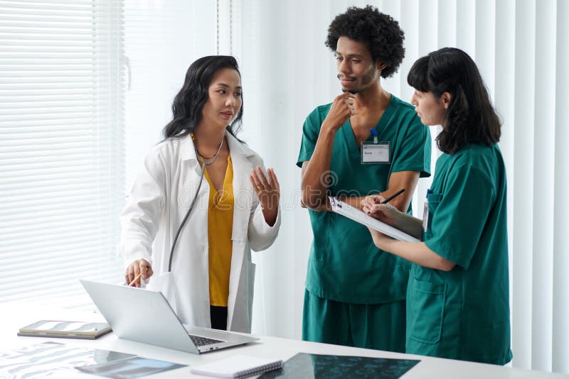 Doctor Talking to Nurses stock image. Image of expertise - 290814081