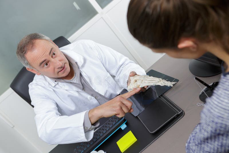 Doctor Explaining for Patient at Consulting Room Stock Image - Image of ...