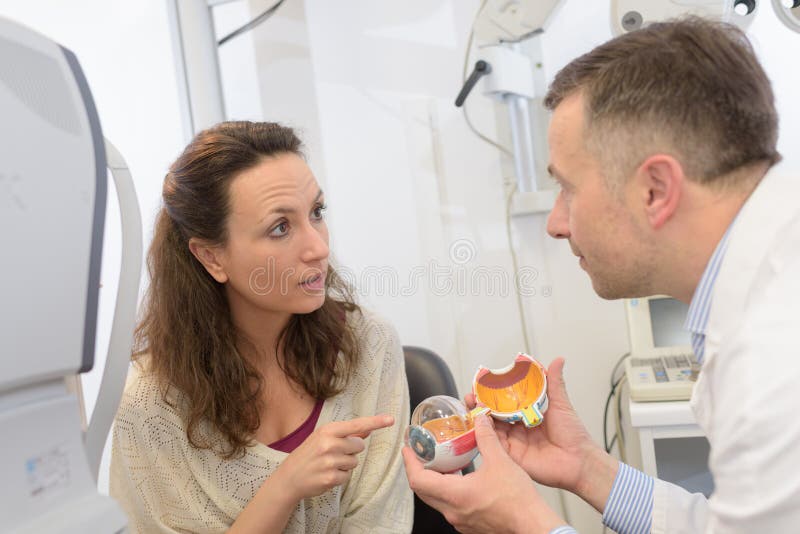 Doctor Explaining Patient Eye Problem Stock Photo - Image of ...