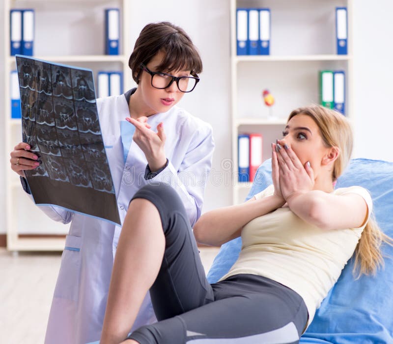 Doctor Explaining X-ray Scan during Consultation Stock Photo - Image of ...