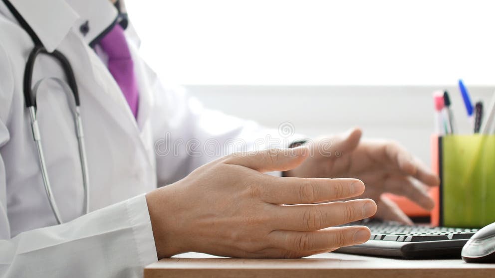 A Doctor Explaining Something by Making Hands Gestures Stock Photo ...
