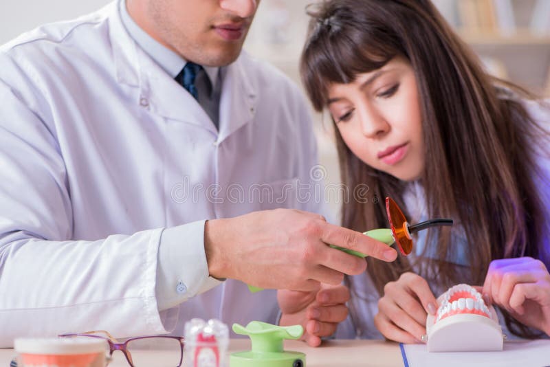 The Doctor Explaining To Assistant How To Use Ultraviolet Gun Stock ...