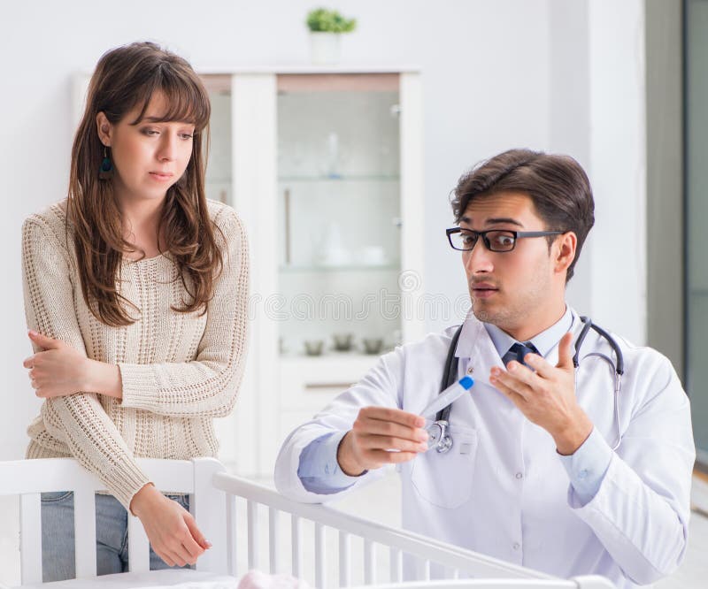 The Doctor Explaining To Young Mother Stock Image - Image of hospital ...