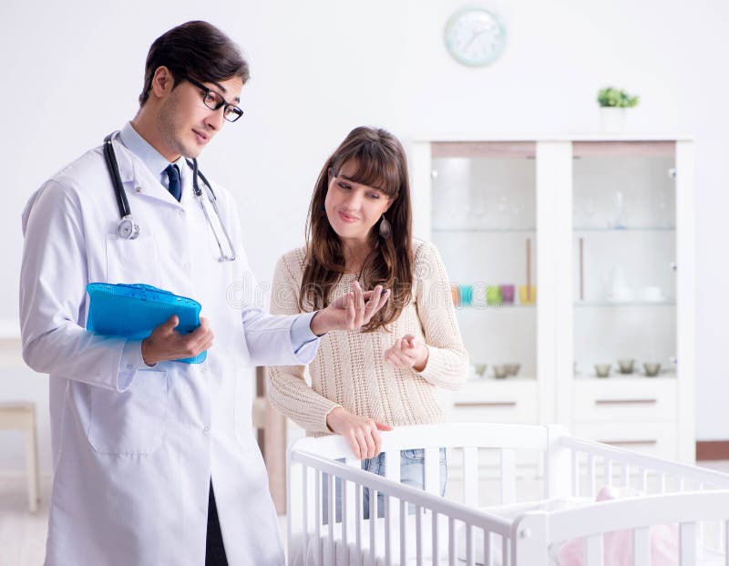 Doctor Explaining To Young Mother Stock Image - Image of little ...