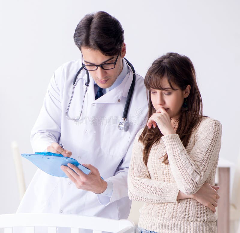 The Doctor Explaining To Young Mother Stock Image - Image of fever ...