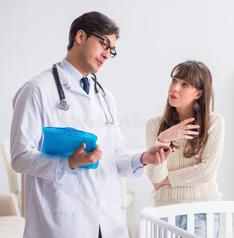 Doctor Explaining To Young Mother Stock Image - Image of baby ...
