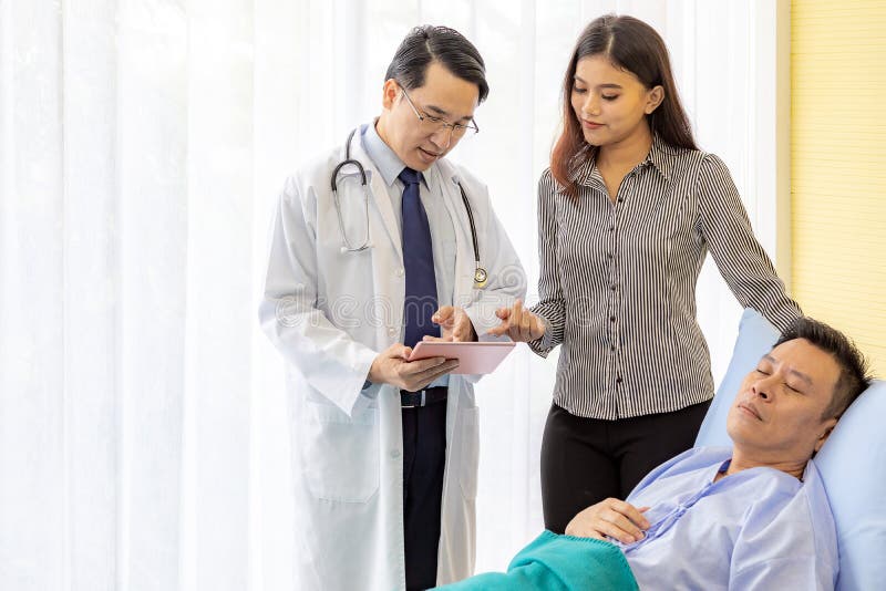 Doctor Explaining Treatment Using Tablet Stock Image - Image of ...