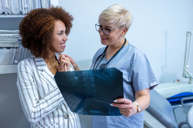 Doctor Explaining the Xray Results To Female Patient Stock Image ...