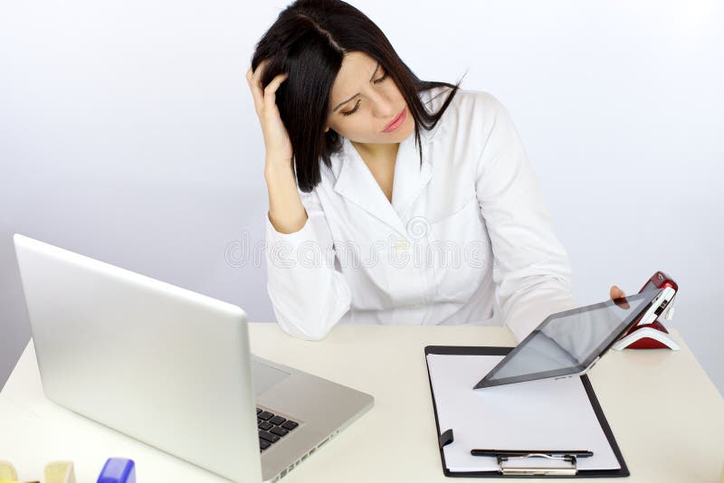 Doctor Feeling Tired about Working with Technology Stock Photo - Image ...