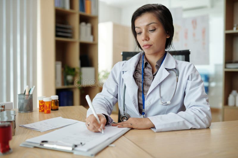 Doctor Filling Medical Documents Stock Photo - Image of doctor ...