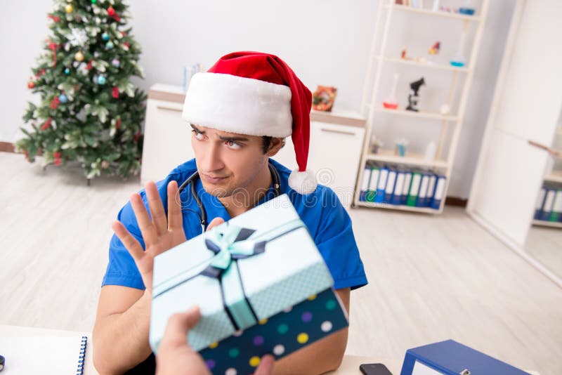 The Doctor with Gift Box in the Hospital Stock Photo - Image of merry ...