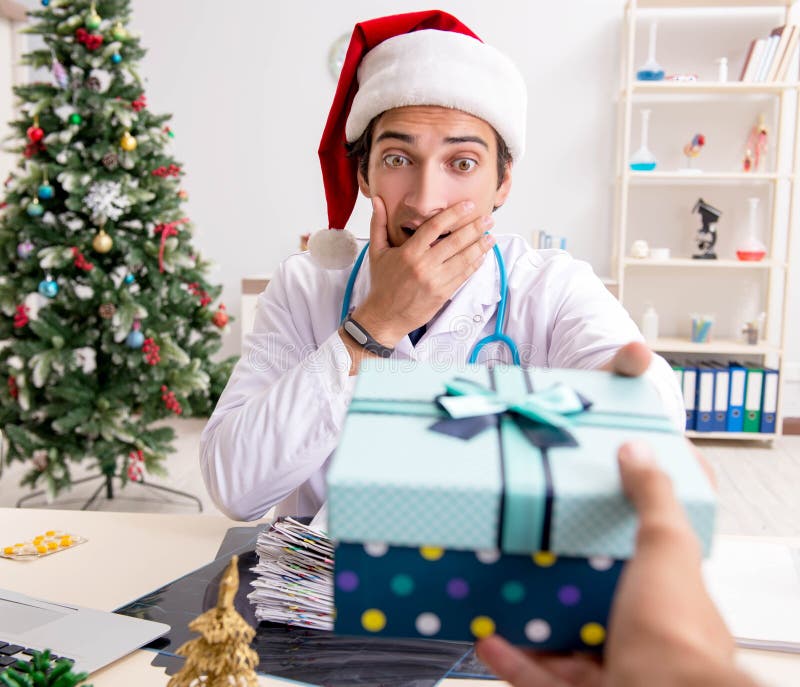Doctor with Gift Box in the Hospital Stock Photo - Image of night ...