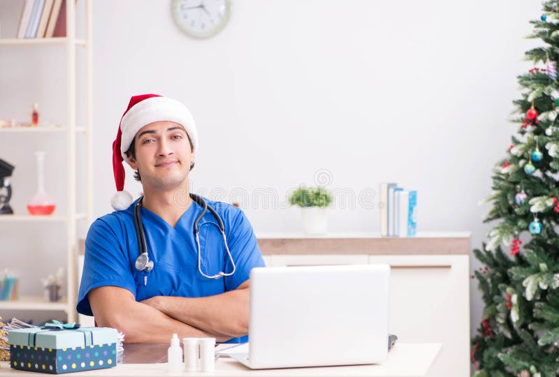 Doctor with Gift Box in the Hospital Stock Image - Image of claus ...