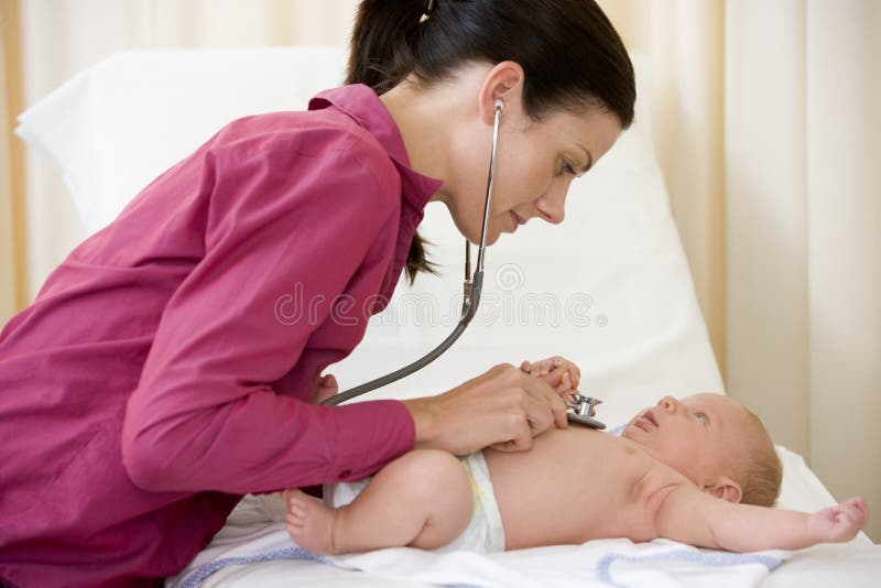 Doctor Giving Checkup To Baby in Exam Room Stock Image - Image of ...