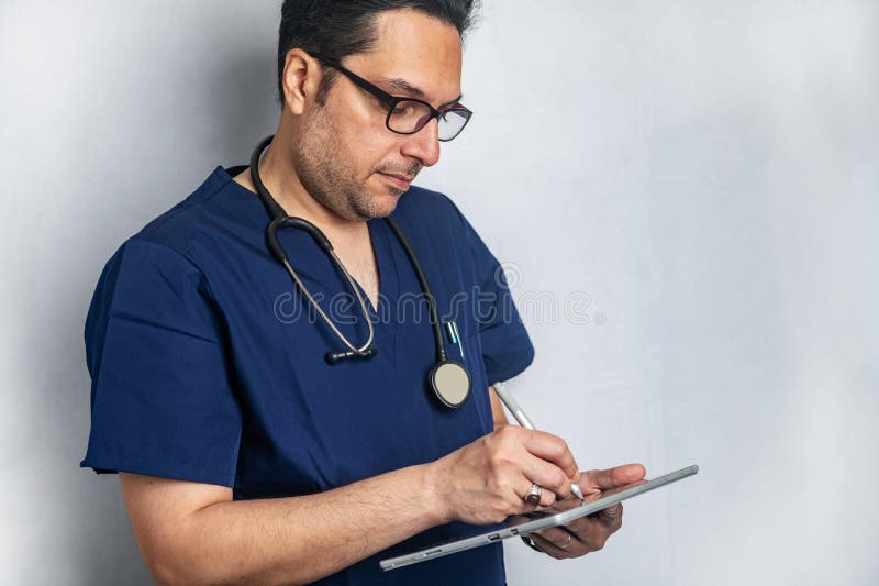 Doctor in Glasses with a Stethoscope and a Tablet. Space for Text Stock ...