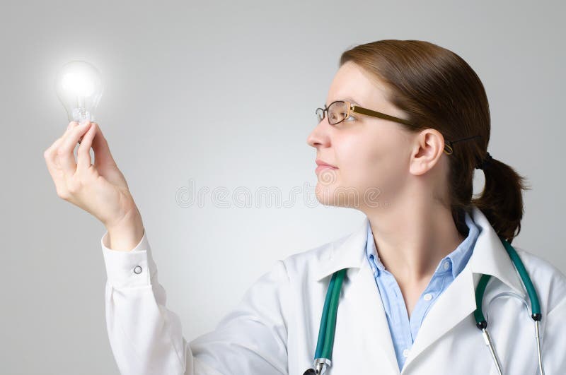 Doctor with Glowing Light Bulb Stock Image - Image of imagination ...