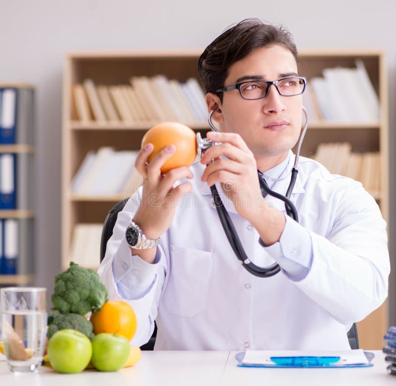 Doctor in GMO food concept stock photo. Image of eating - 236681120