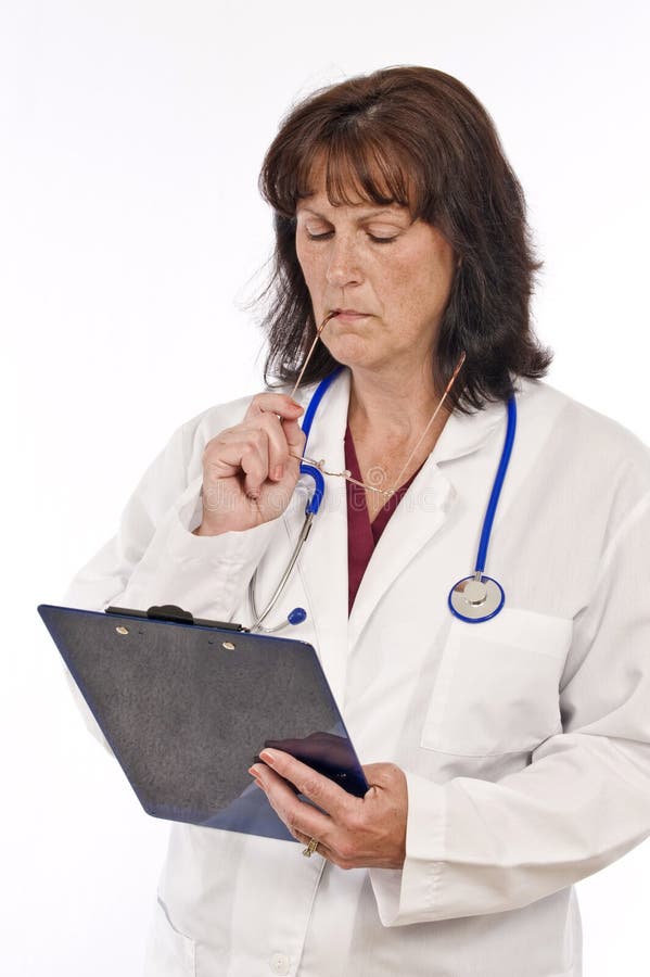 Doctor Going Over Notes stock photo. Image of girl, occupation - 46916284