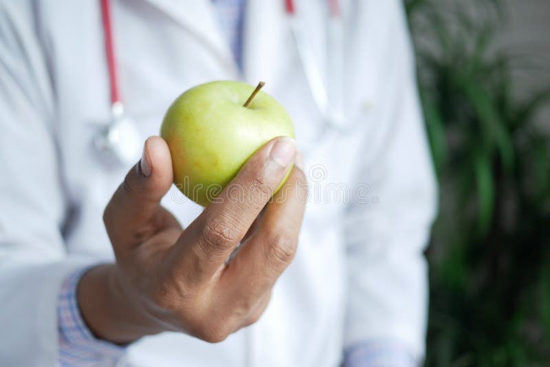 Doctor Hand Holding Green Apple Close Up Stock Image - Image of color ...