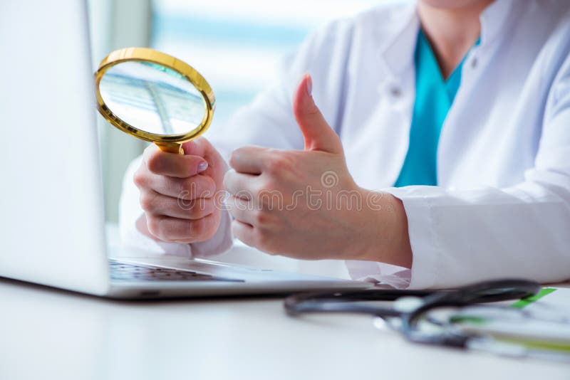 The Doctor Hand with Magnifying Glass Stock Photo - Image of laptop ...