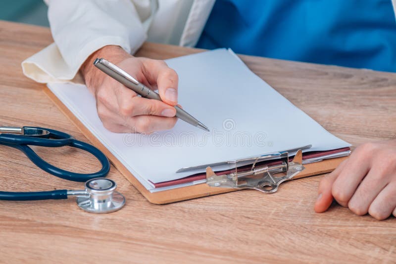 Doctor Hand Writing on Document Stock Image - Image of healthy, company ...