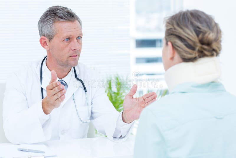 Doctor Having Conversation with His Patient Stock Photo - Image of male ...