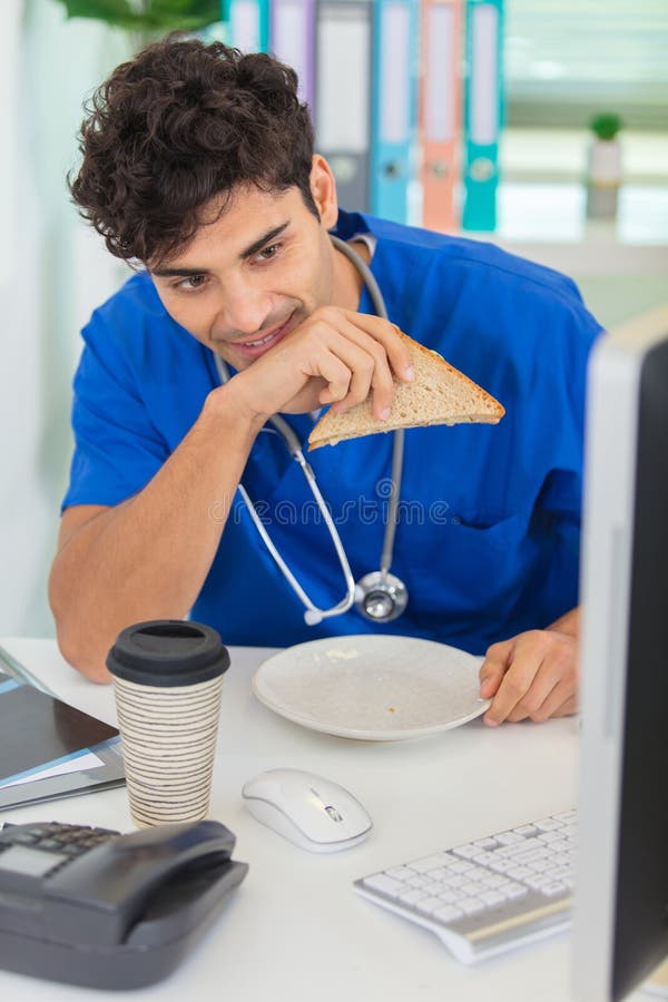 Doctor Having Lunch at Office during Break Stock Image - Image of ...