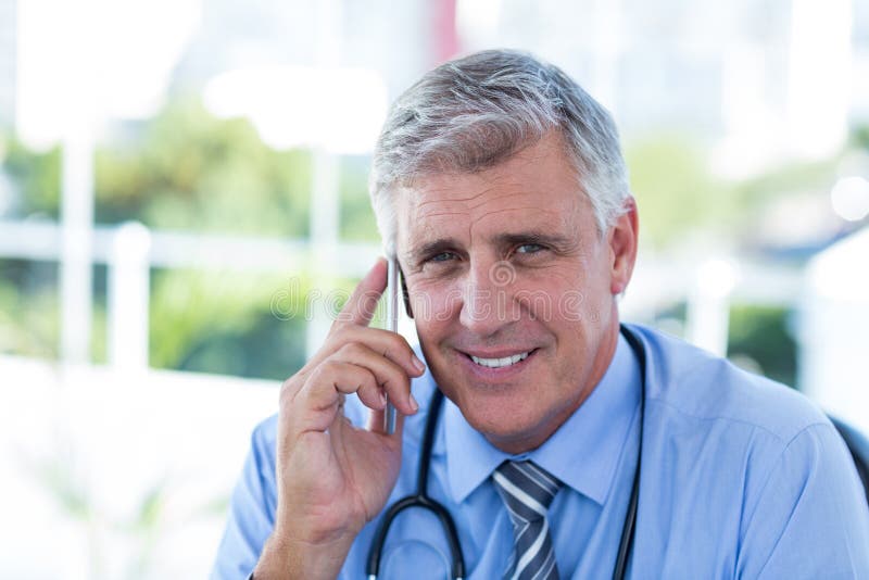Doctor having phone call stock photo. Image of person - 54763154