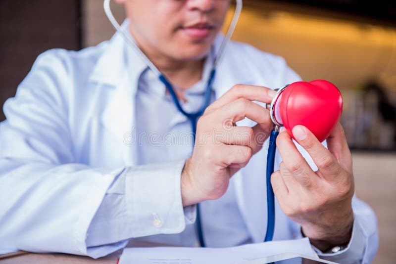 Doctor with Heart Disease Checker Stock Photo - Image of heartbeat ...